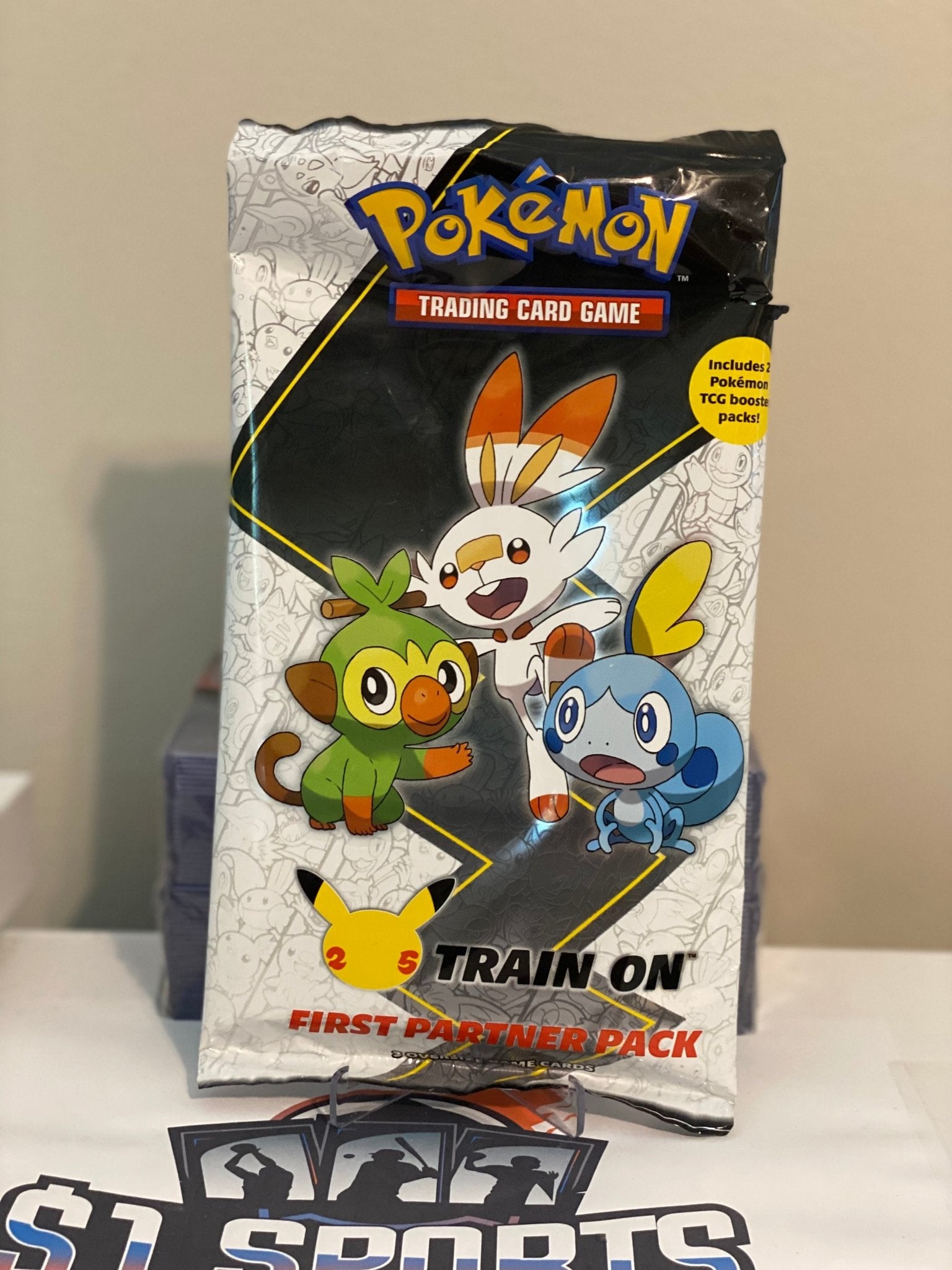 Pokemon TCG: 25th Anniversary First Partner Trainer Pack – $1 Sports Cards